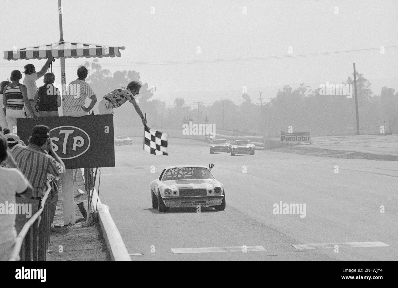Cale Yarborough waves from his race car Sunday, Oct. 17, 1976 at ...