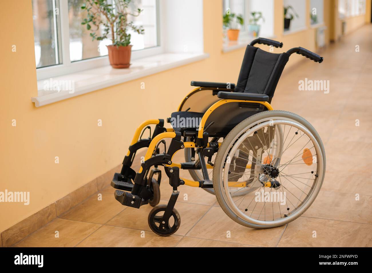 Children's wheelchair. Empty wheelchair in the hospital Stock Photo - Alamy