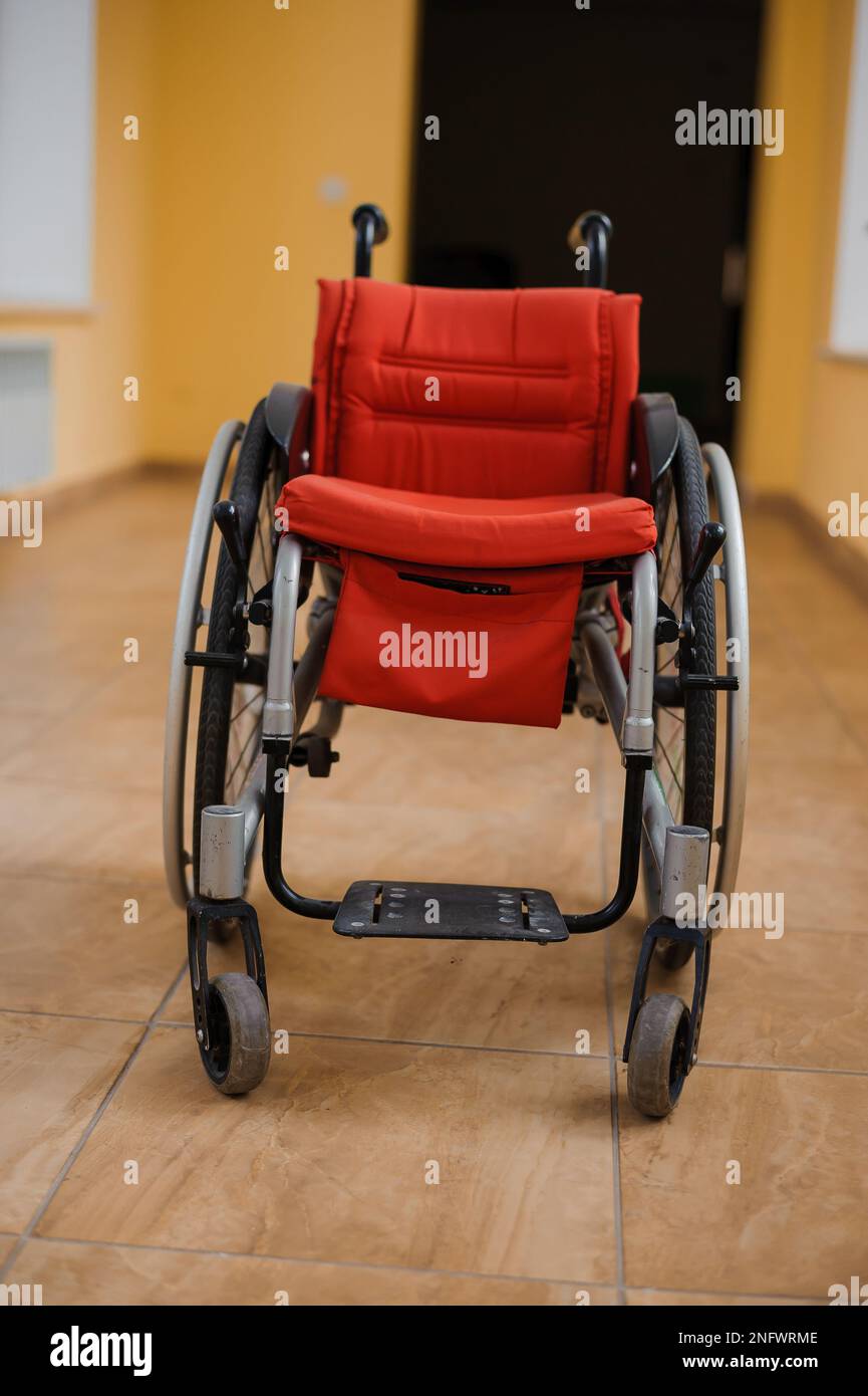 Children's wheelchair. Empty wheelchair in the hospital Stock Photo - Alamy