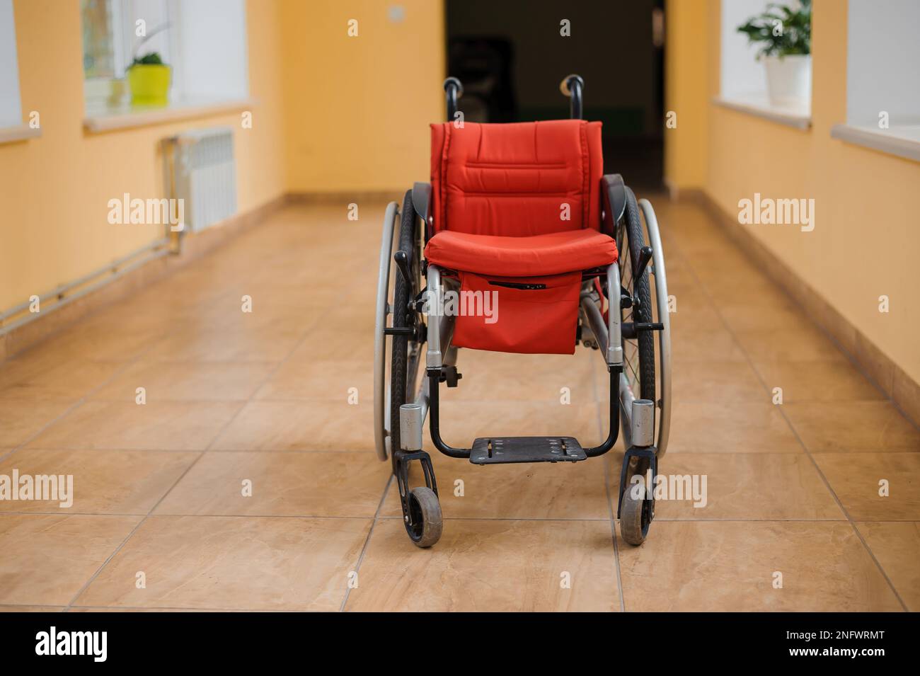 Children's wheelchair. Empty wheelchair in the hospital Stock Photo - Alamy
