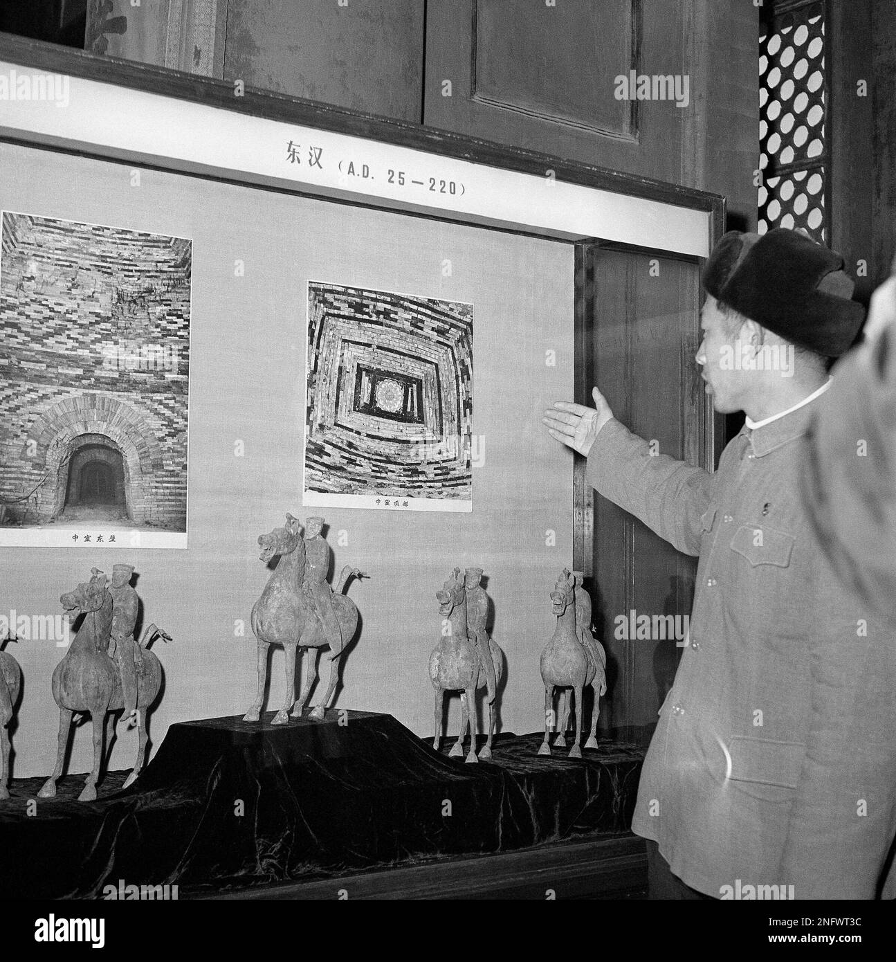 A guide explains artifacts on display in the Forbidden City on Feb. 20 ...