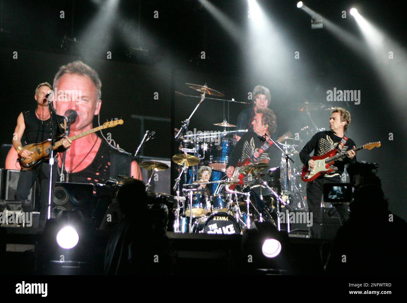 Lead vocalist and bassist Sting, left, guitarist Andy Summers, right ...
