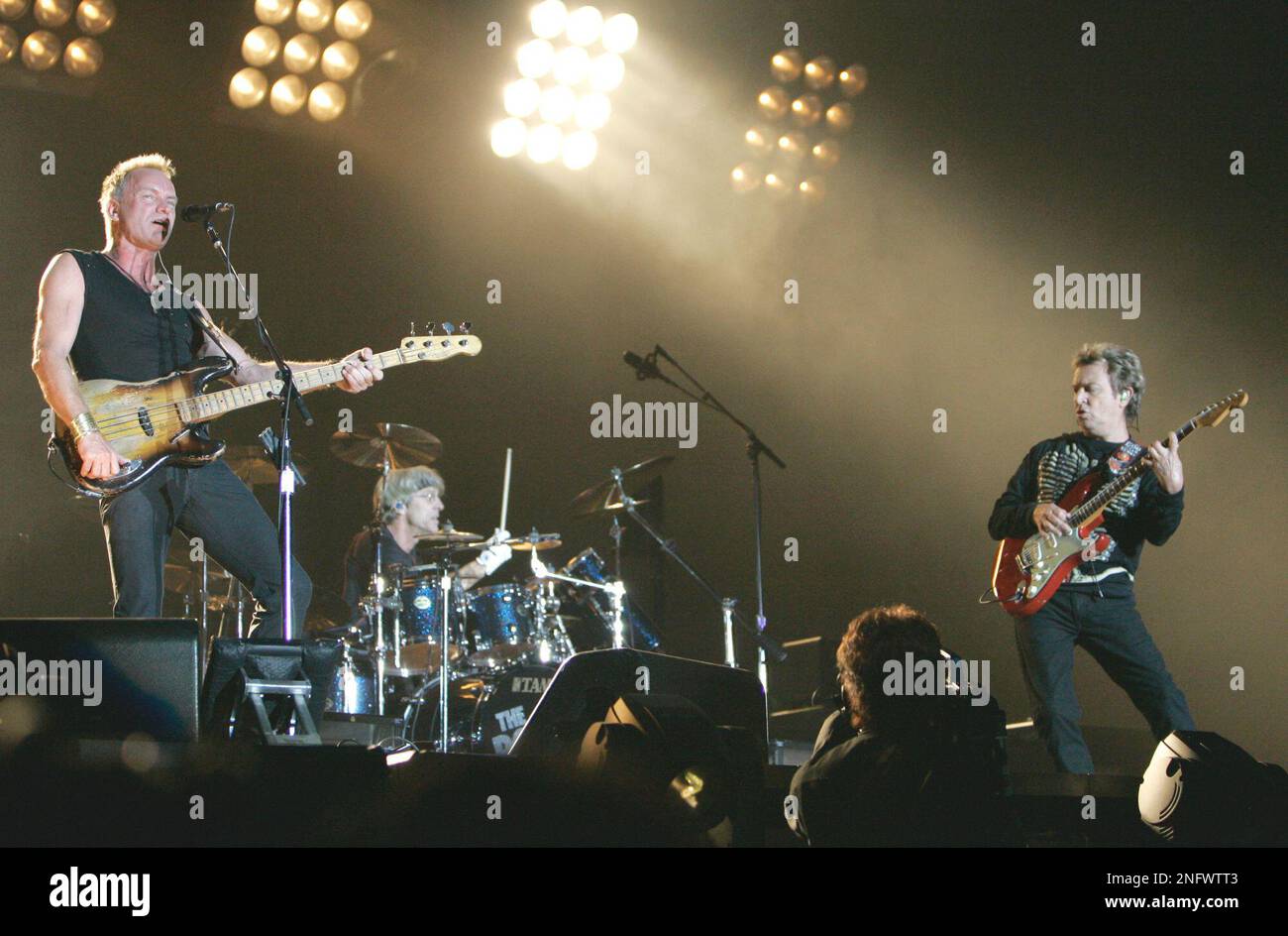 Lead vocalist and bassist Sting, left, guitarist Andy Summers, right ...