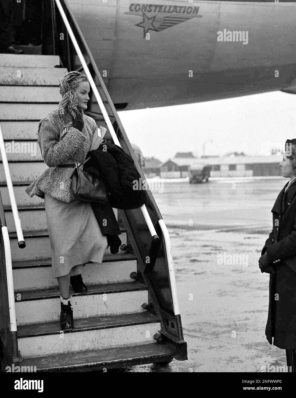 American tobacco heiress Doris Duke, alighting from Pan American plane ...