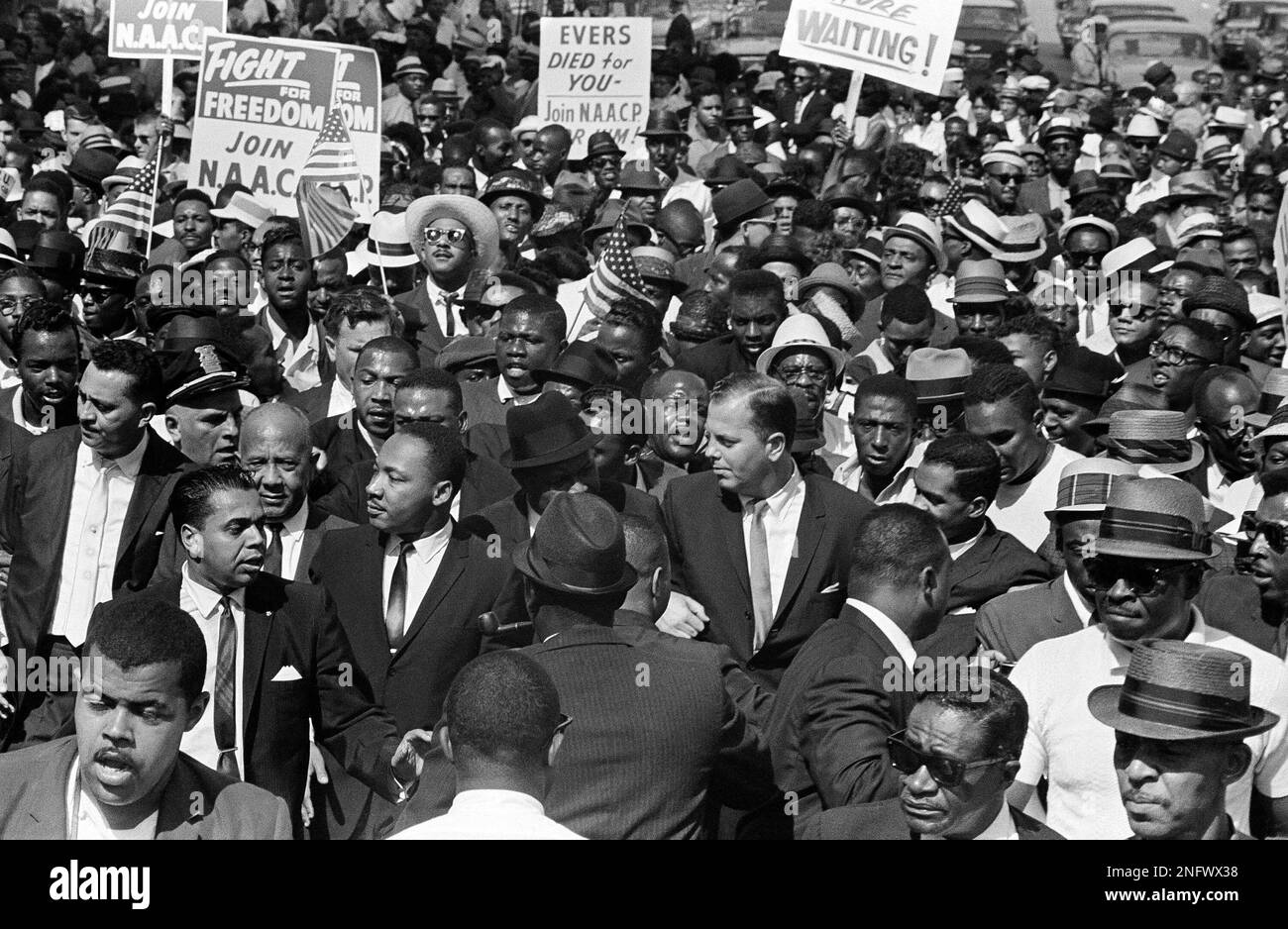 Pipe-smoking man bottom center being restrained as he heads for Rev ...