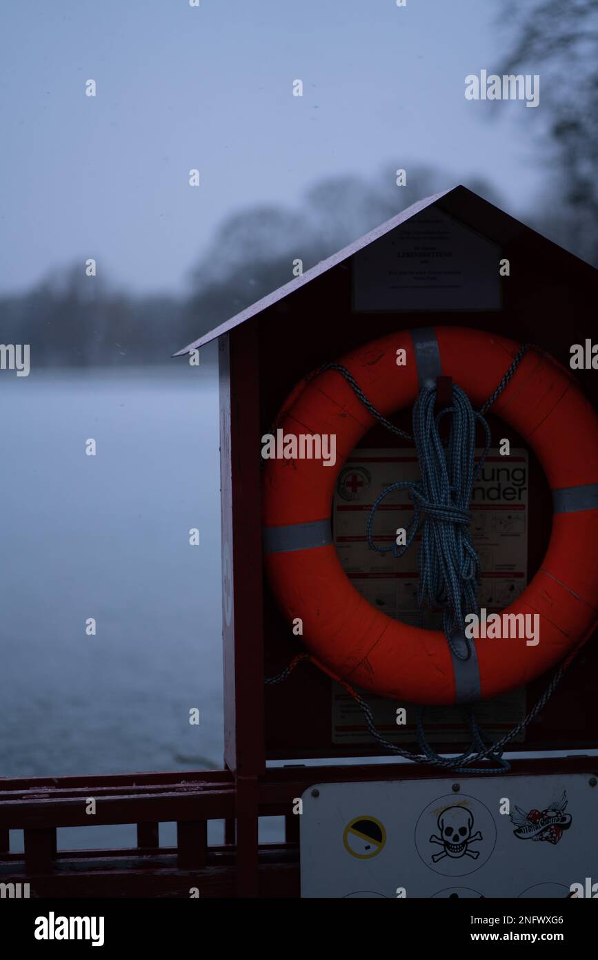 A view of the blurred water from the red lifeline Stock Photo - Alamy