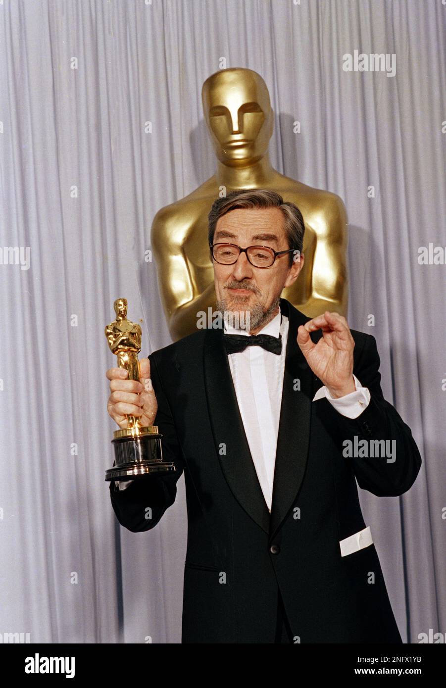 Gabriel Axel gestures backstage Monday, April 12, 1988 at the Shrine ...