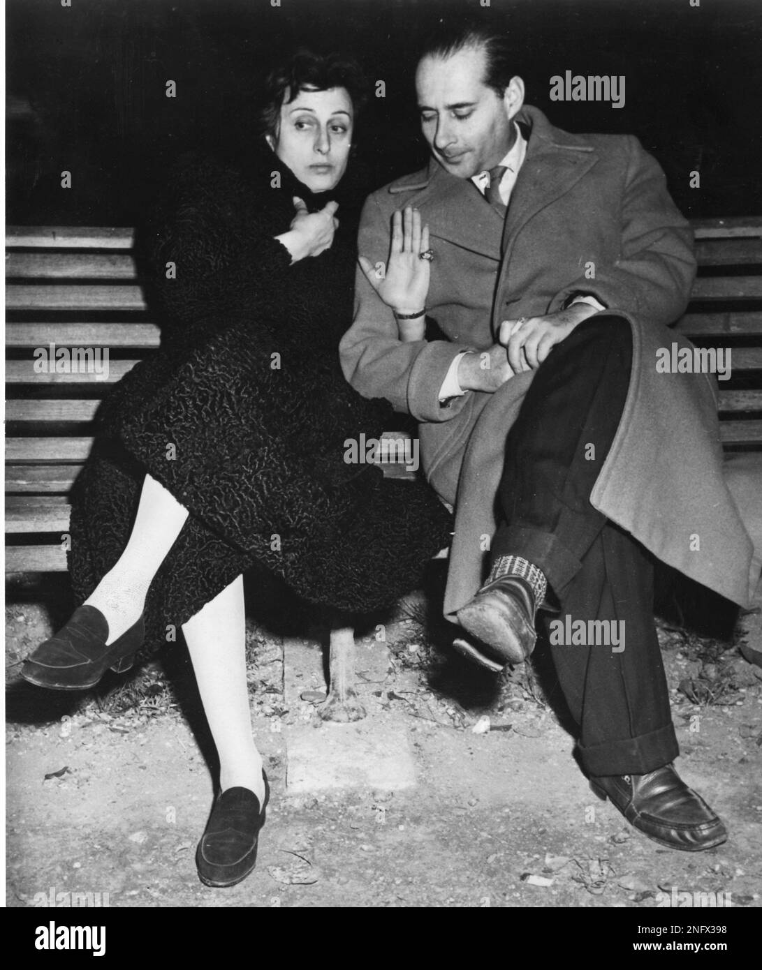 Famous Italian film and stage actress Anna Magnani, locks arms with her ...