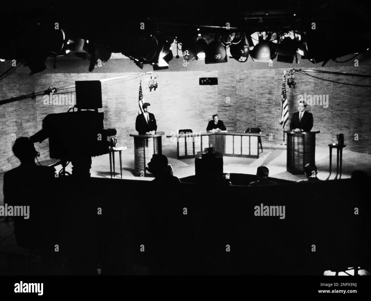 John F. Kennedy with Richard M. Nixon shown during a TV debate in 1960 ...