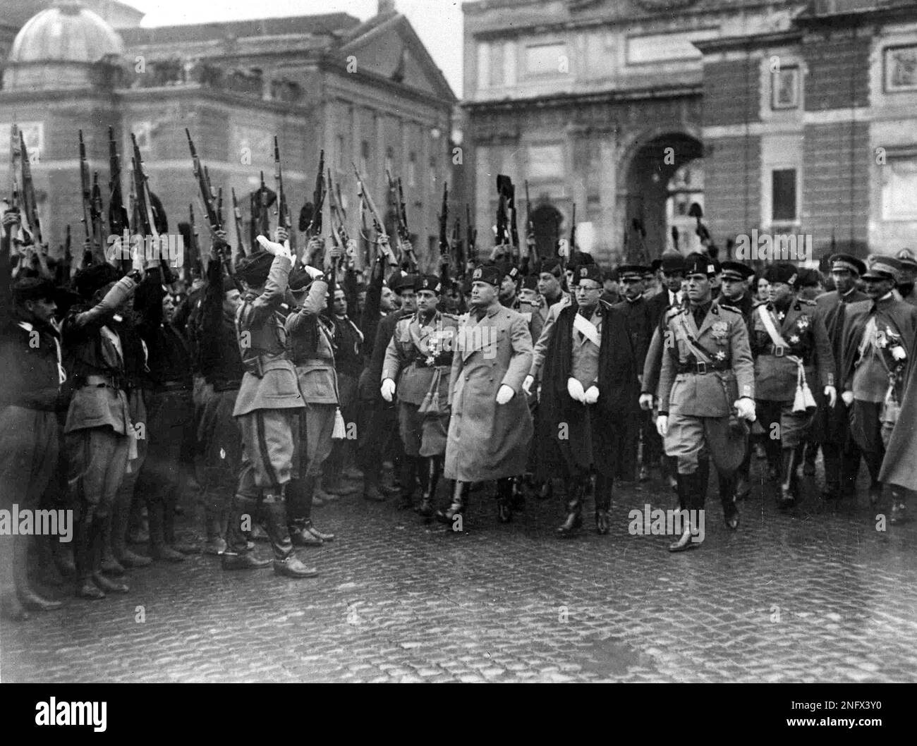Italian dictator Benito Mussolini, third from right front row, is ...