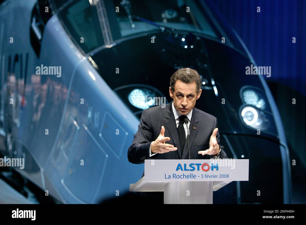 France's President Nicolas Sarkozy delivers a speech in front of the ...