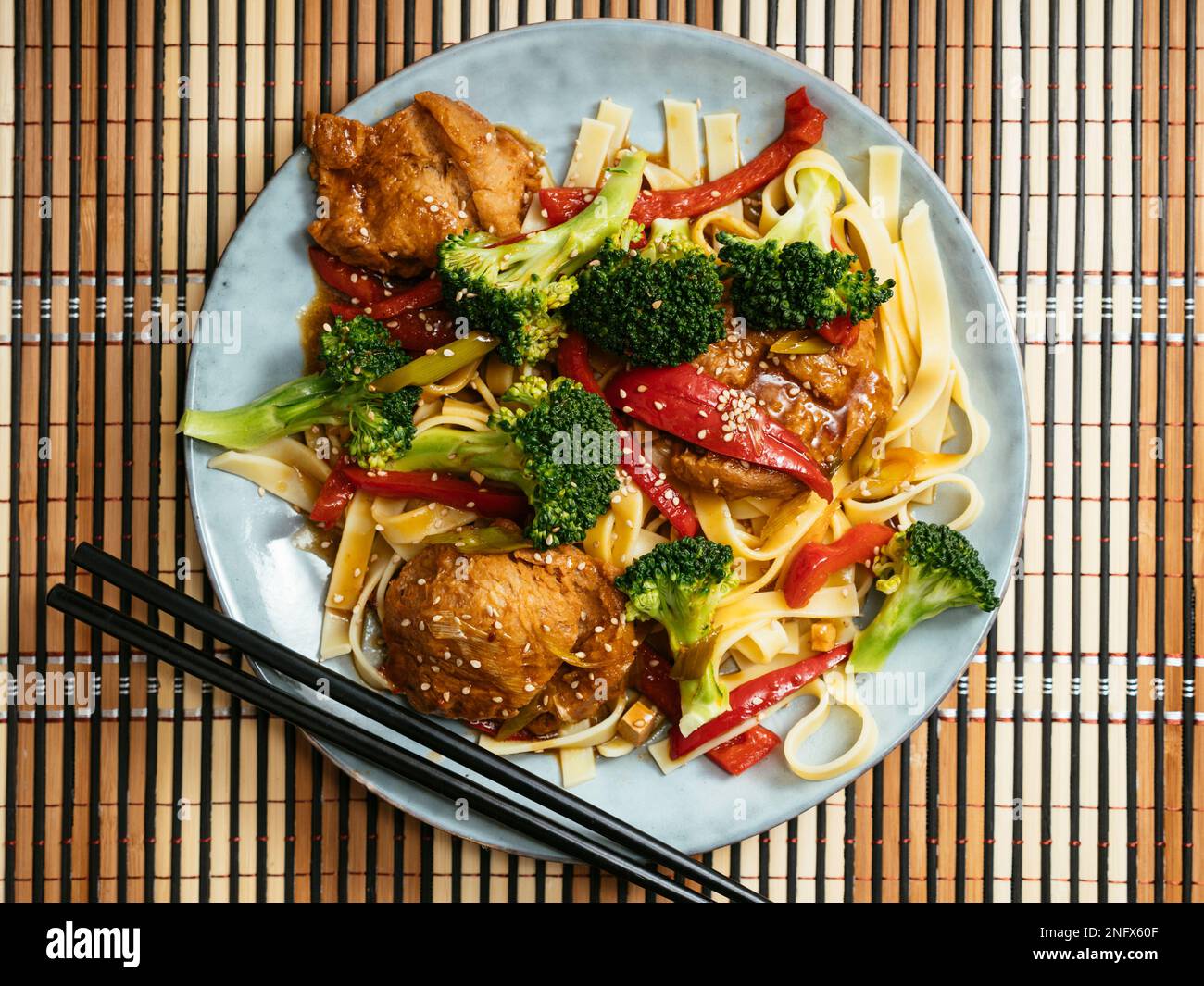 Broccoli, TVP Medallion Stir Fry on Noodles Stock Photo - Alamy