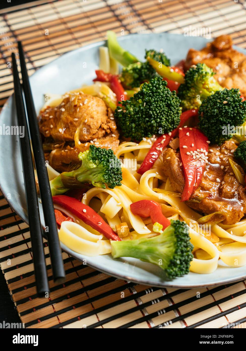 Broccoli, TVP Medallion Stir Fry on Noodles Stock Photo - Alamy