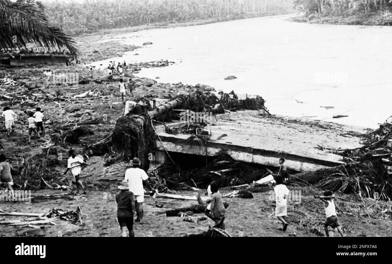 Resident of the central Philliphines island of Leyte search for ...