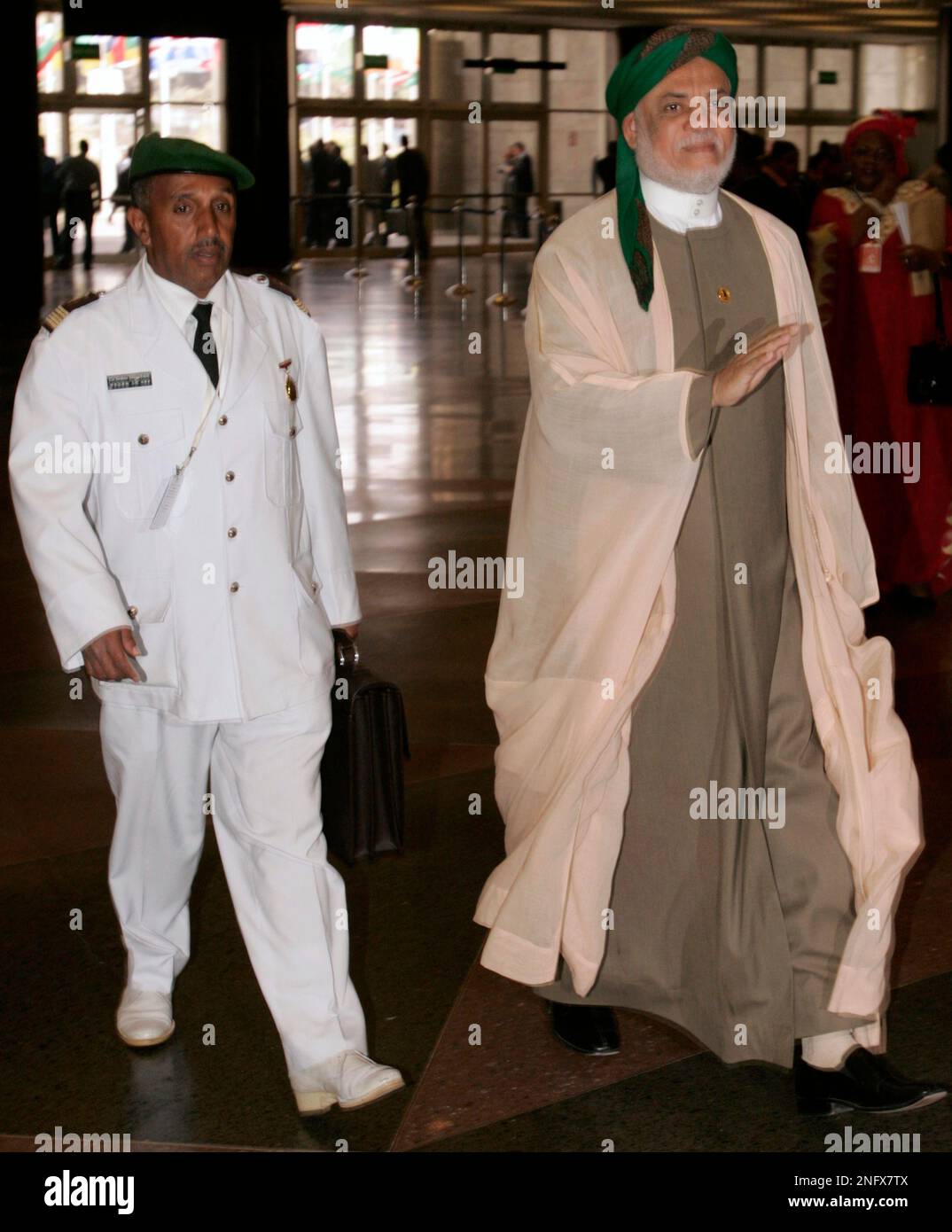 President of Comoros, Ahmed Abdallah Sambi, right, is seen at the ...