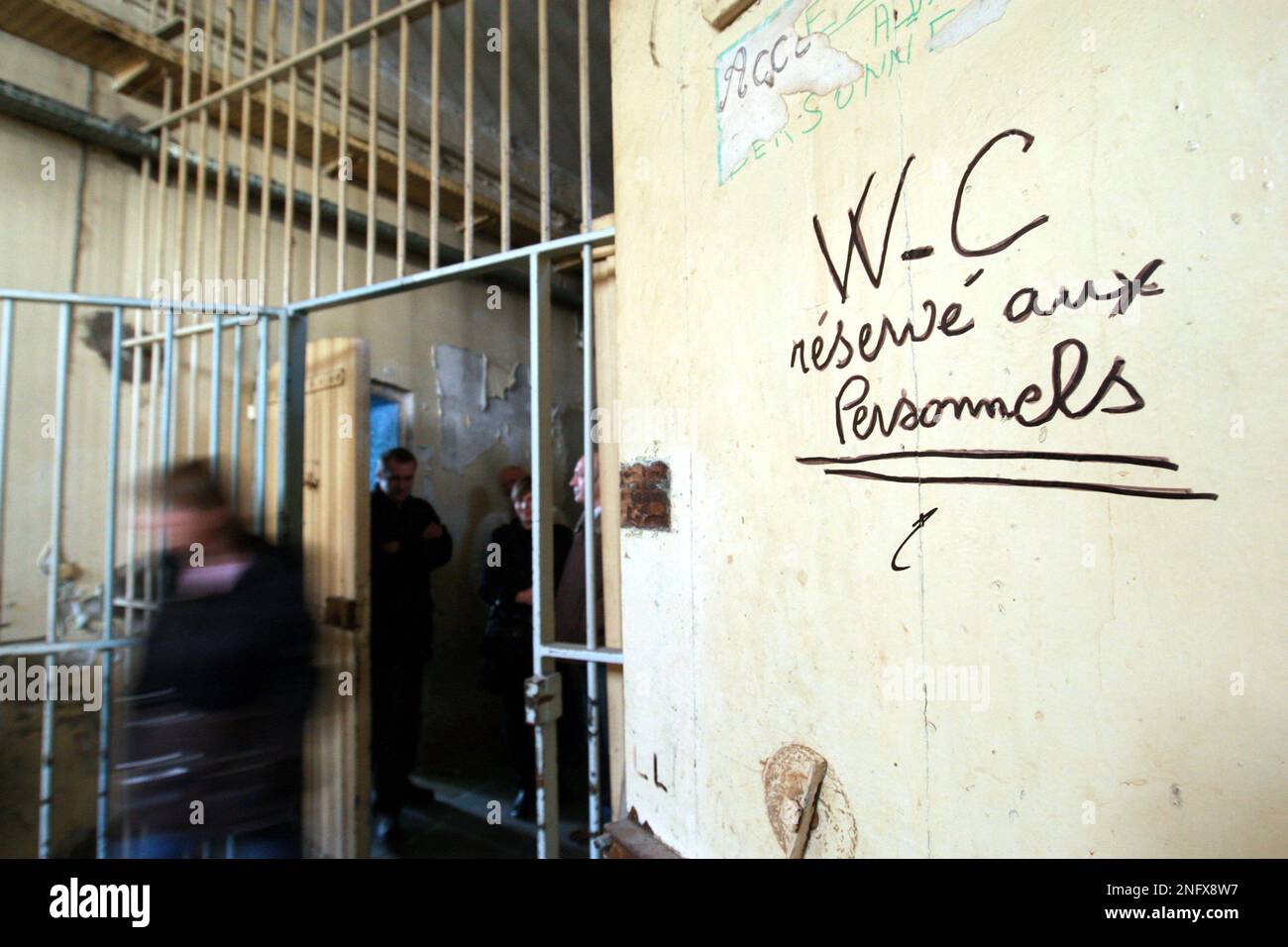 Visitors walk in the 19th century Sainte-Anne prison in Avignon ...