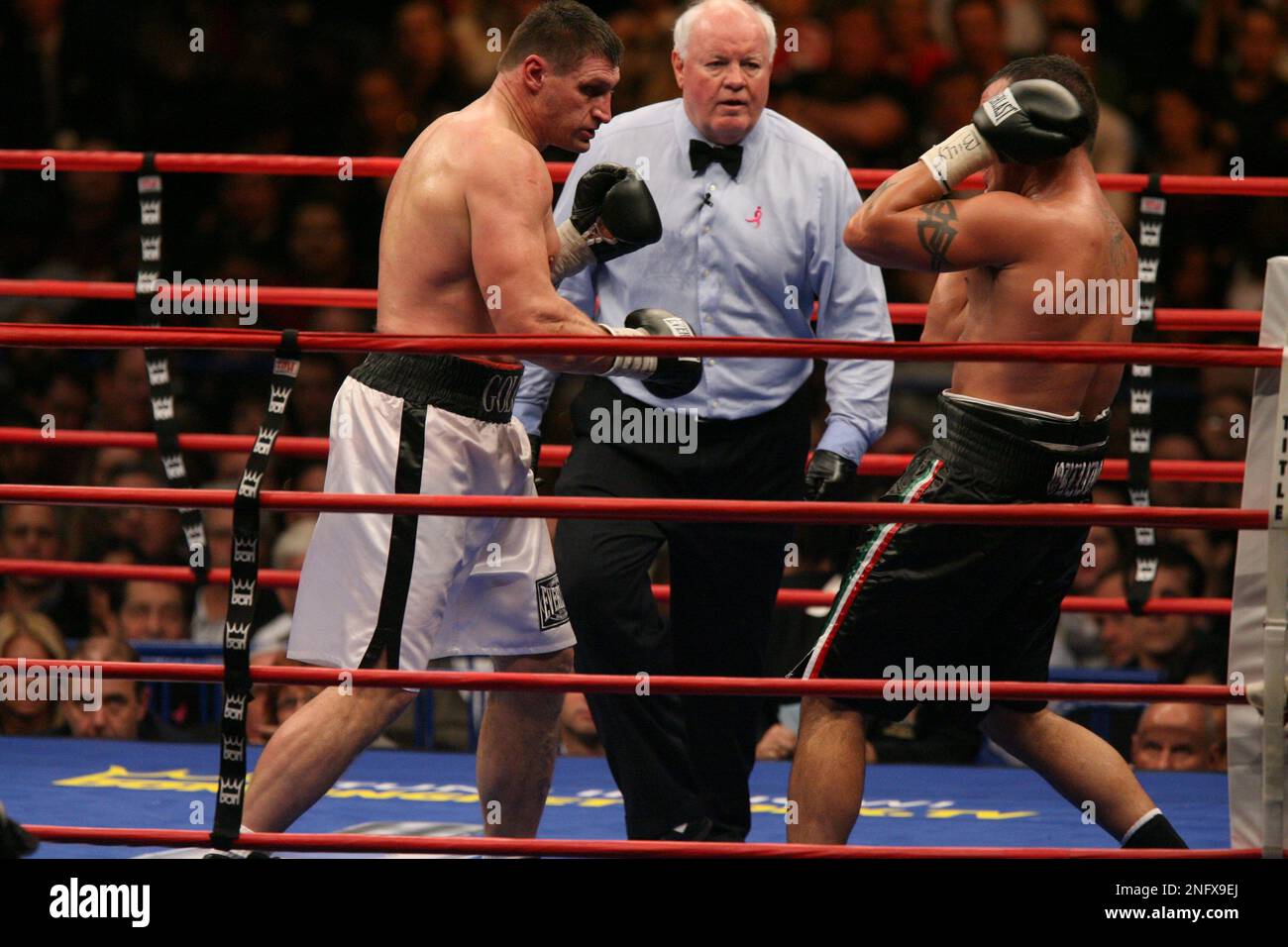 Referee Randy Newman, background, watches Andrew Golota, left, and ...