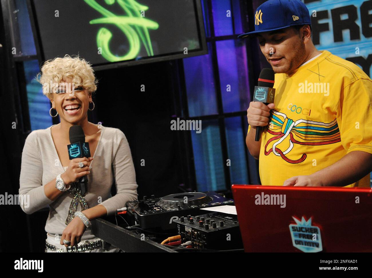 Singer - actress Keyshia Cole, left, chats with DJ Cipha Sounds during ...