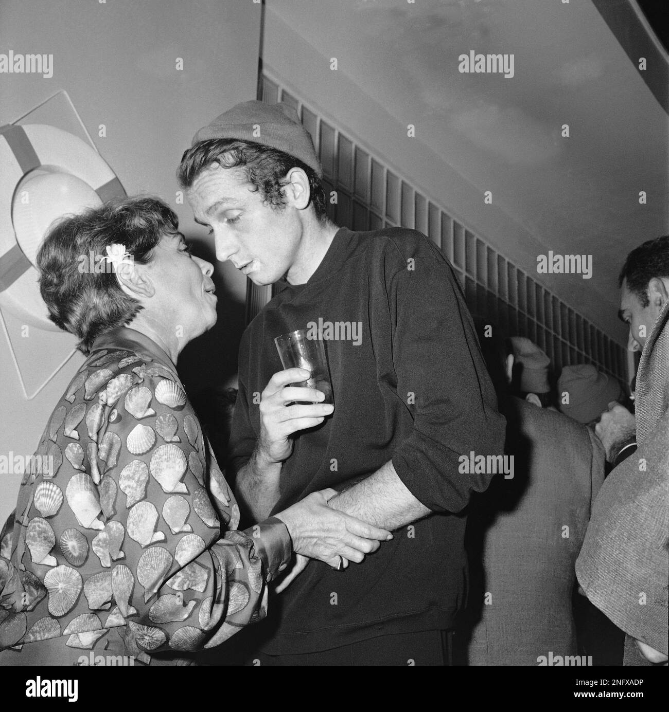 Mrs Simone Cousteau kisses her son Philippe, one of the crew members of ...