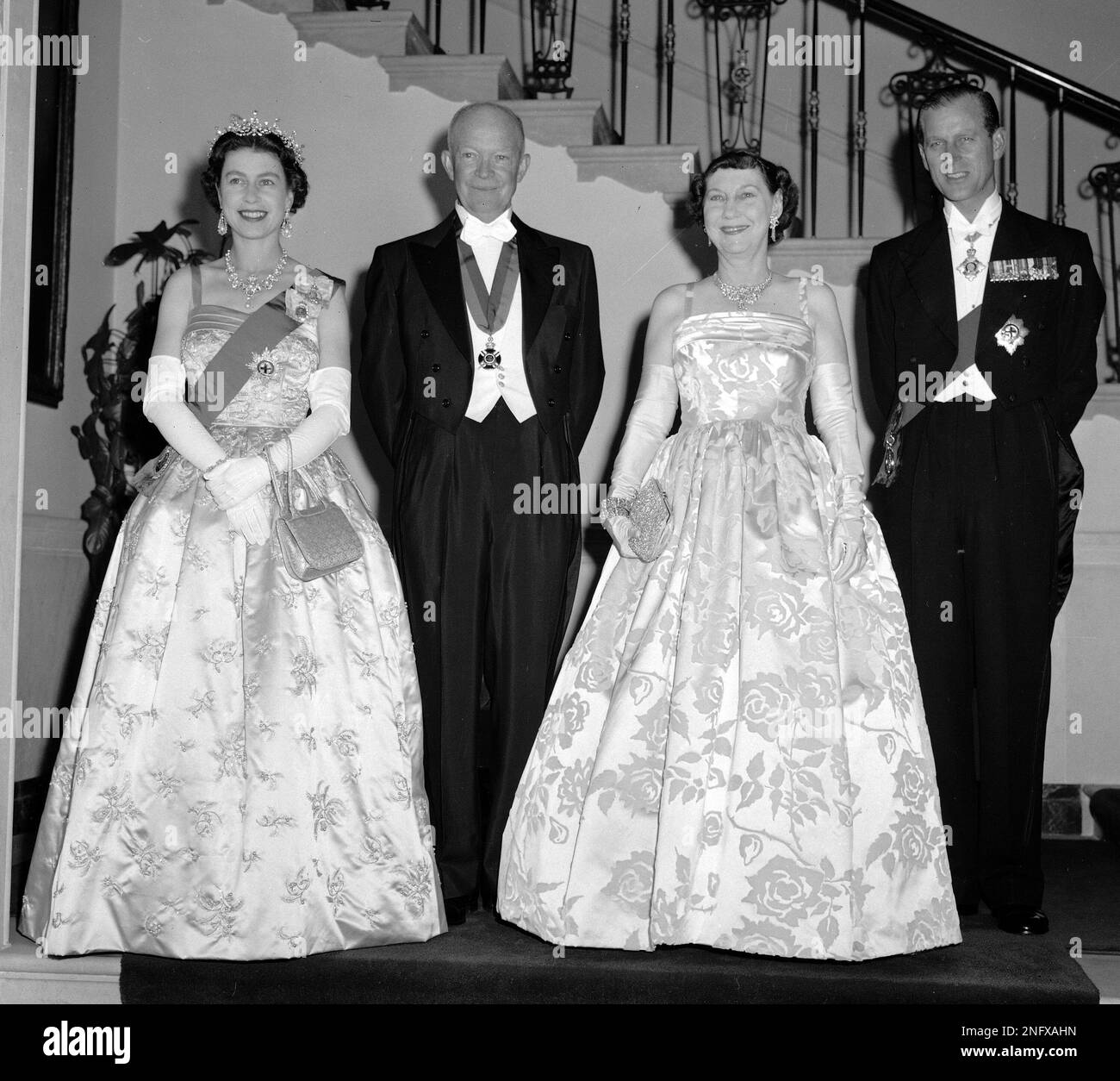 President Dwight Eisenhower and first lady Mamie are flanked by their ...