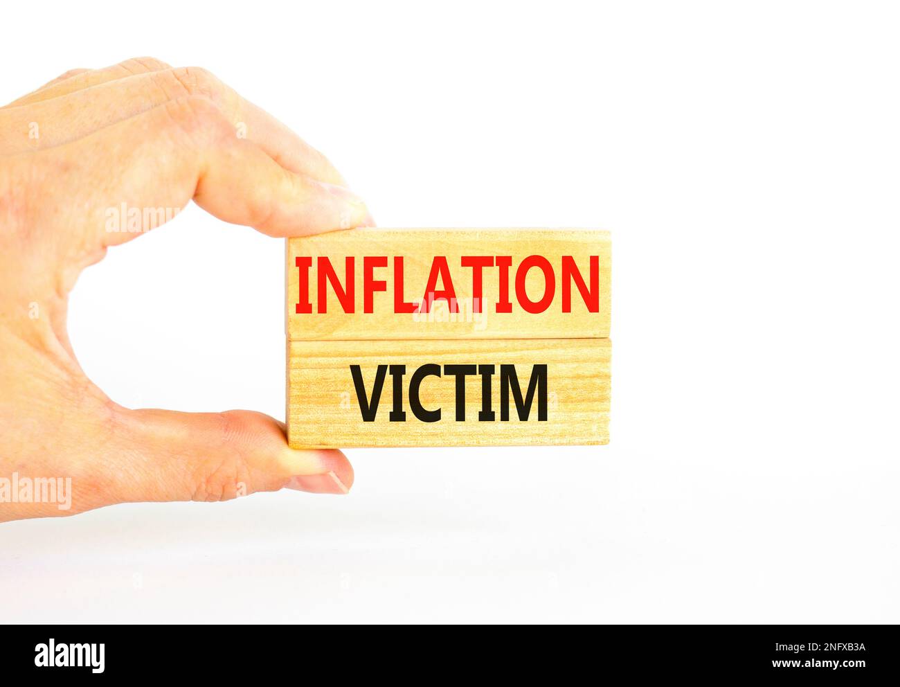 Inflation victim symbol. Concept words Inflation victim on wooden block ...