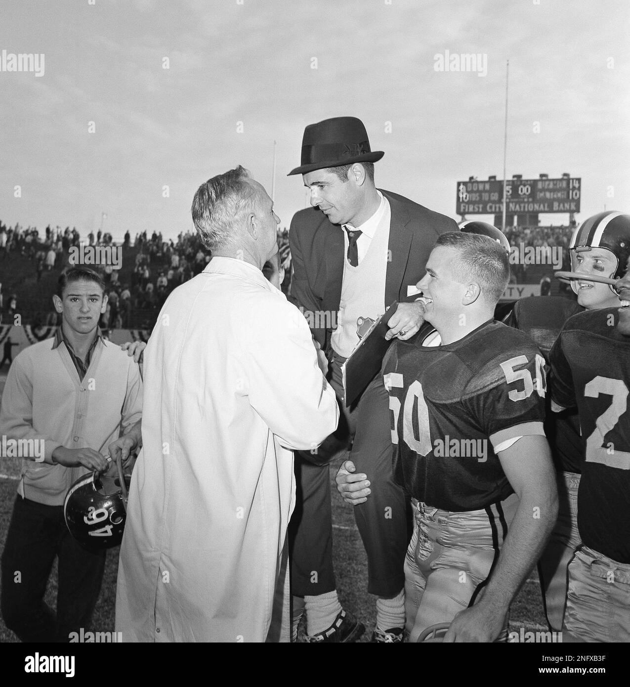Georgia Tech Coach Bobby Dodd, left, congratulates Missouri Coach Dan ...