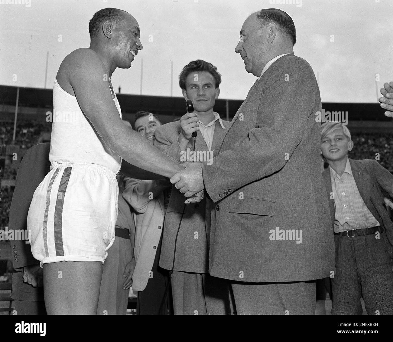 Dr. Walter Schreiber, acting mayor of West Berlin, right, congratulates ...
