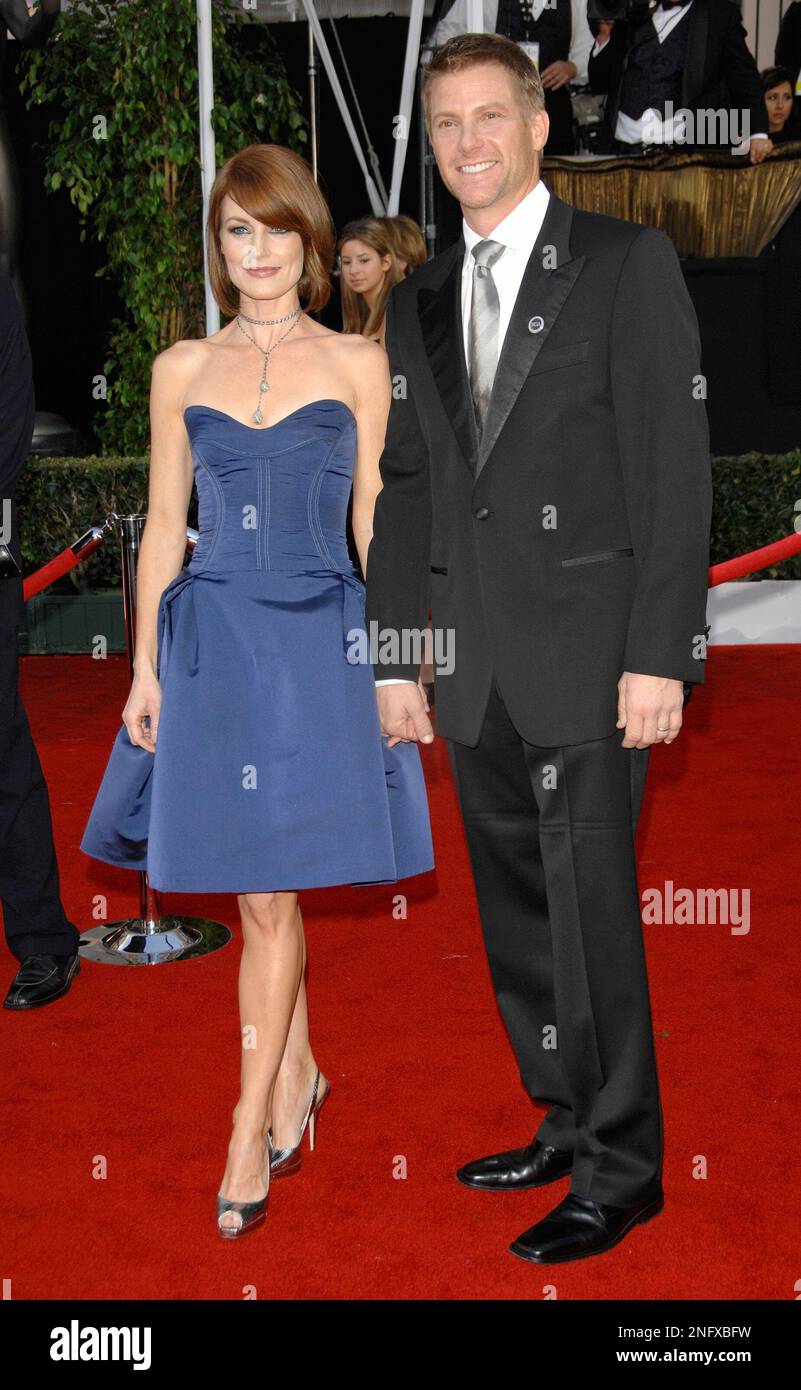 Doug Savant, right, and his wife Laura Leighton arrive at the 14th ...