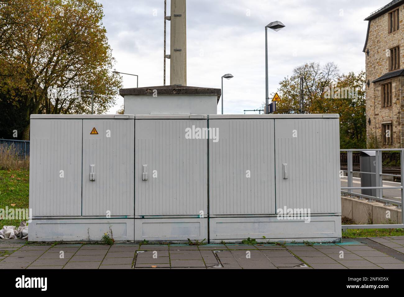 White electrical distribution cabinets on a city street. Frontal view ...