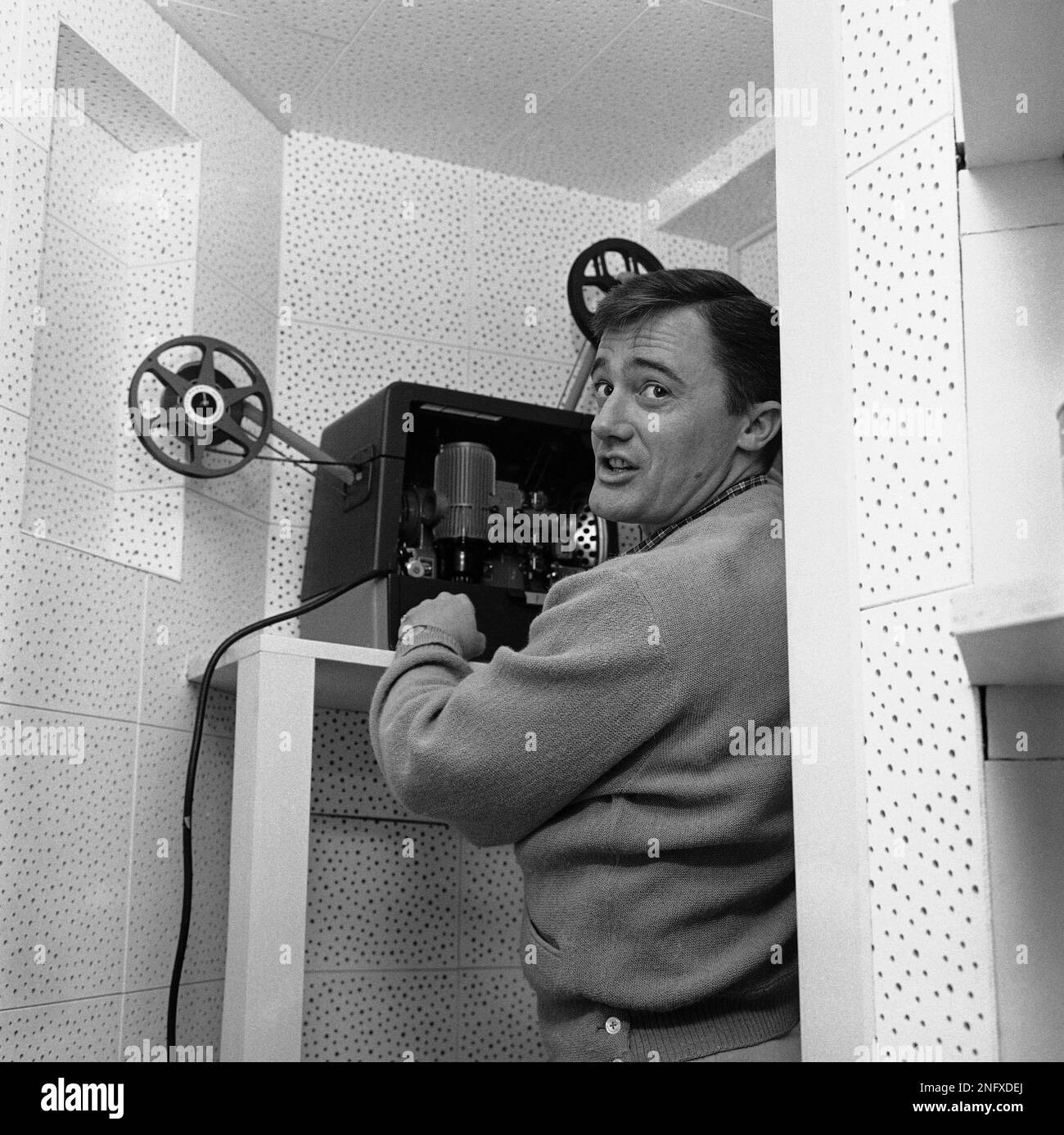 Actor Robert Vaughn prepares to run some movies at his home in Hollywood Hills, California ...
