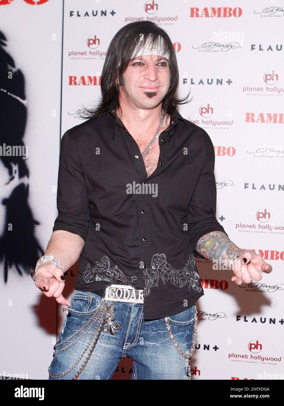Michael Godard arrives at the Rambo premiere at Planet Hollywood Hotel ...