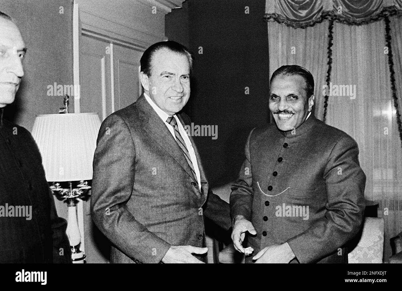 President of Pakistan Mohammad Zia-Ul-Haq right, greets former U.S ...