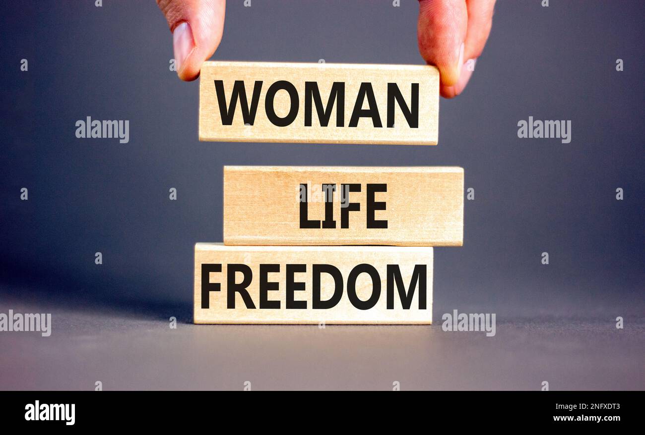 Woman life freedom symbol. Concept words Woman Life Freedom on wooden ...