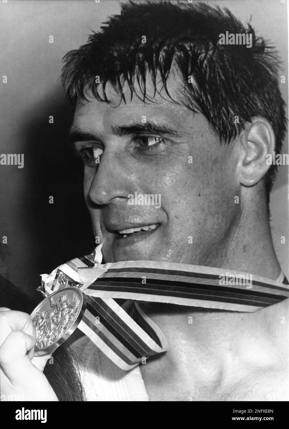 World Judo Champion Anton Geesing of the Netherlands, holds his gold ...