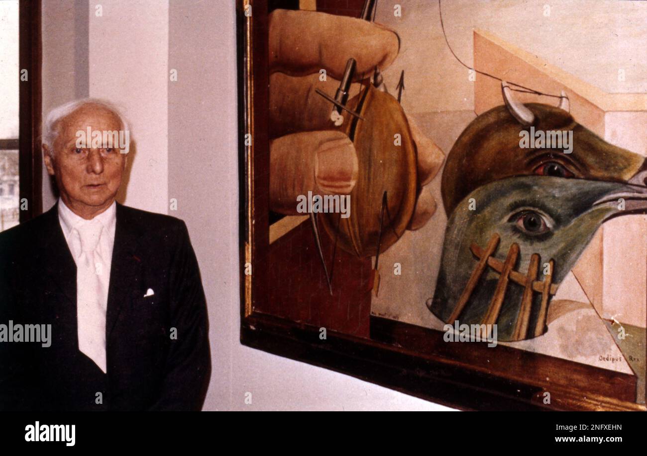 German artist, painter Max Ernst stands next to his oil on canvas ...