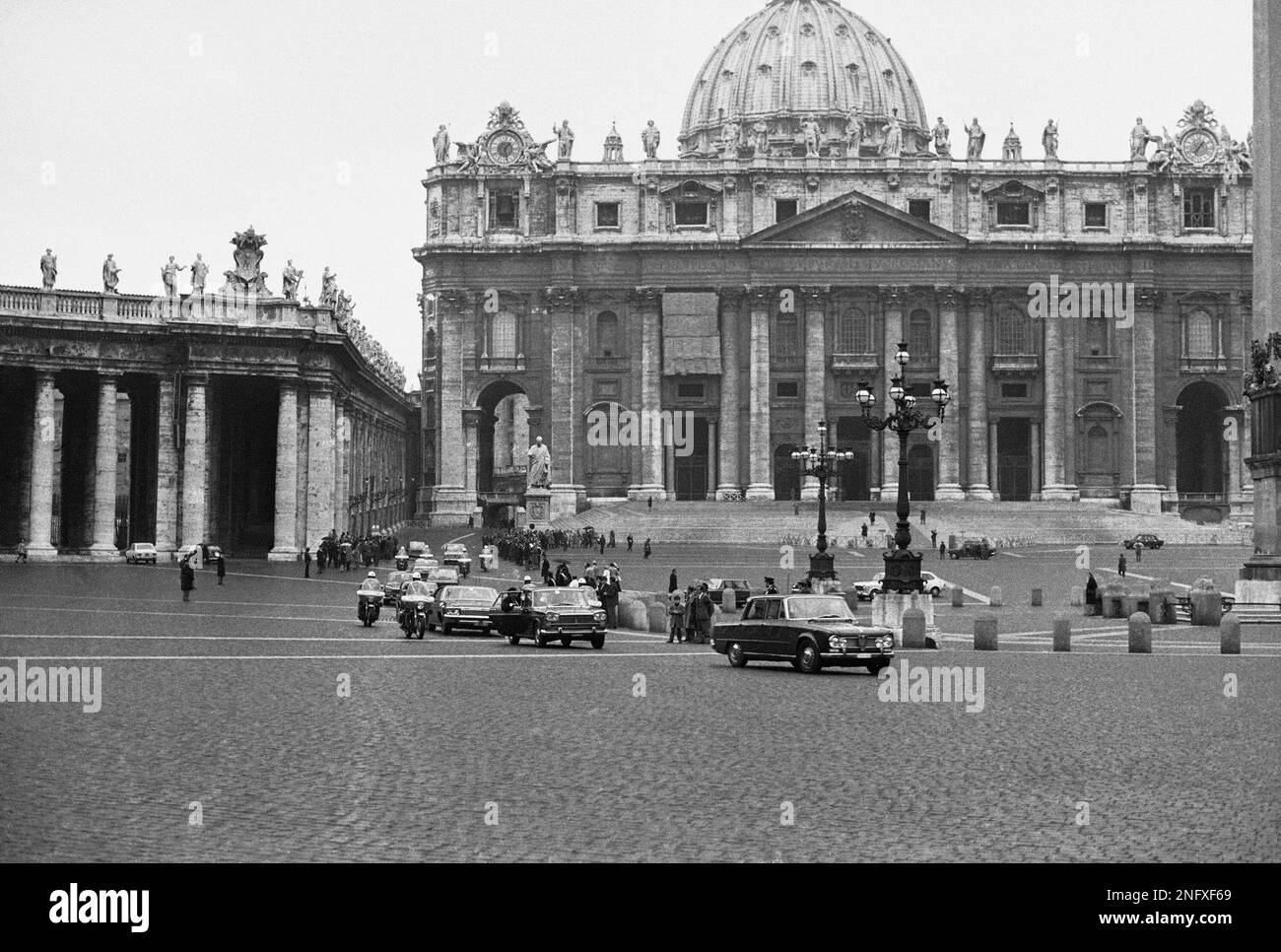 An Israeli security agent lower left leans from the open door of an ...