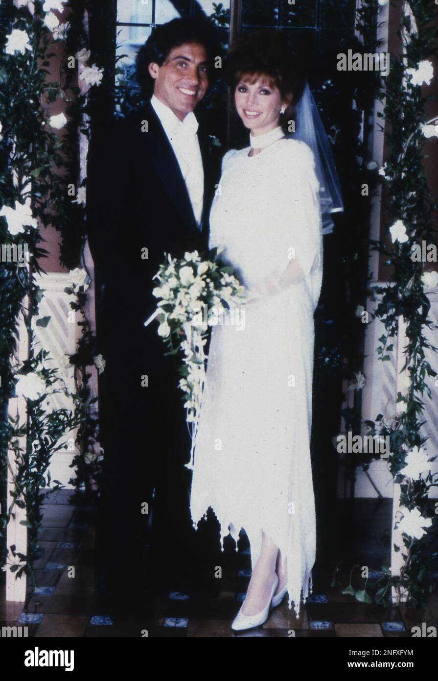 Dr. Harry Glassman looks at his wife, "Dallas" star U.S. American ...