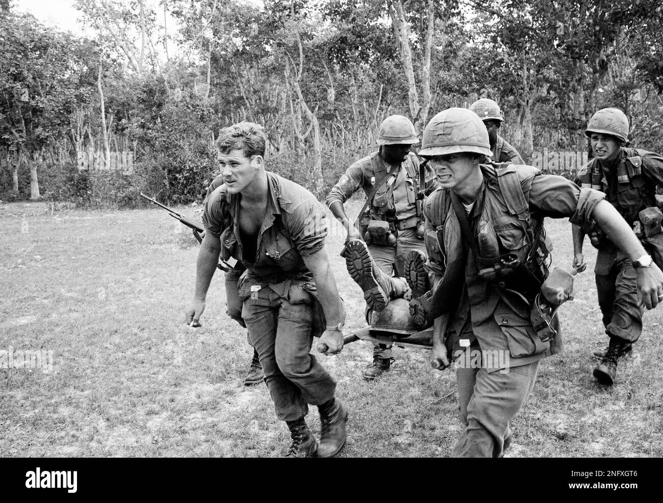 Medics rush Lt. Col. George Eyster on a stretcher toward a helicopter ...