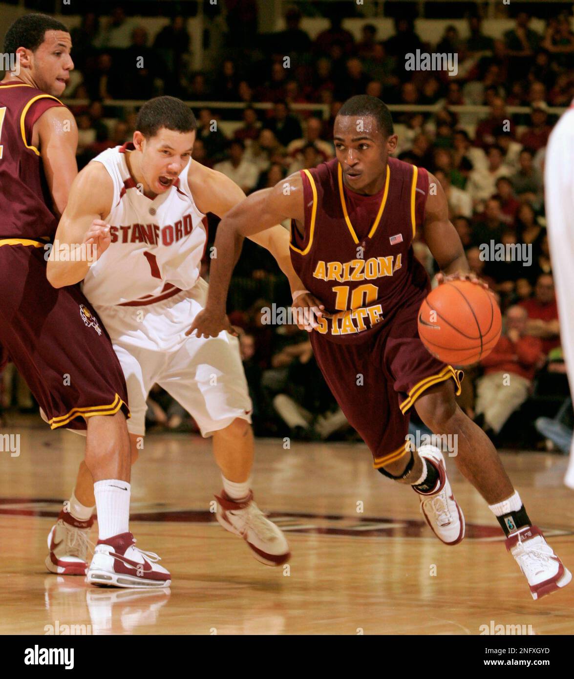 Arizona State's Jamelle McMillan, right, dribbles past Stanford's Mitch ...