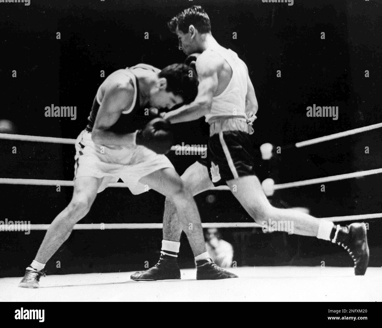 Canada's Edward Haddad, right, lands a left to the body of Egypt's Ezz ...