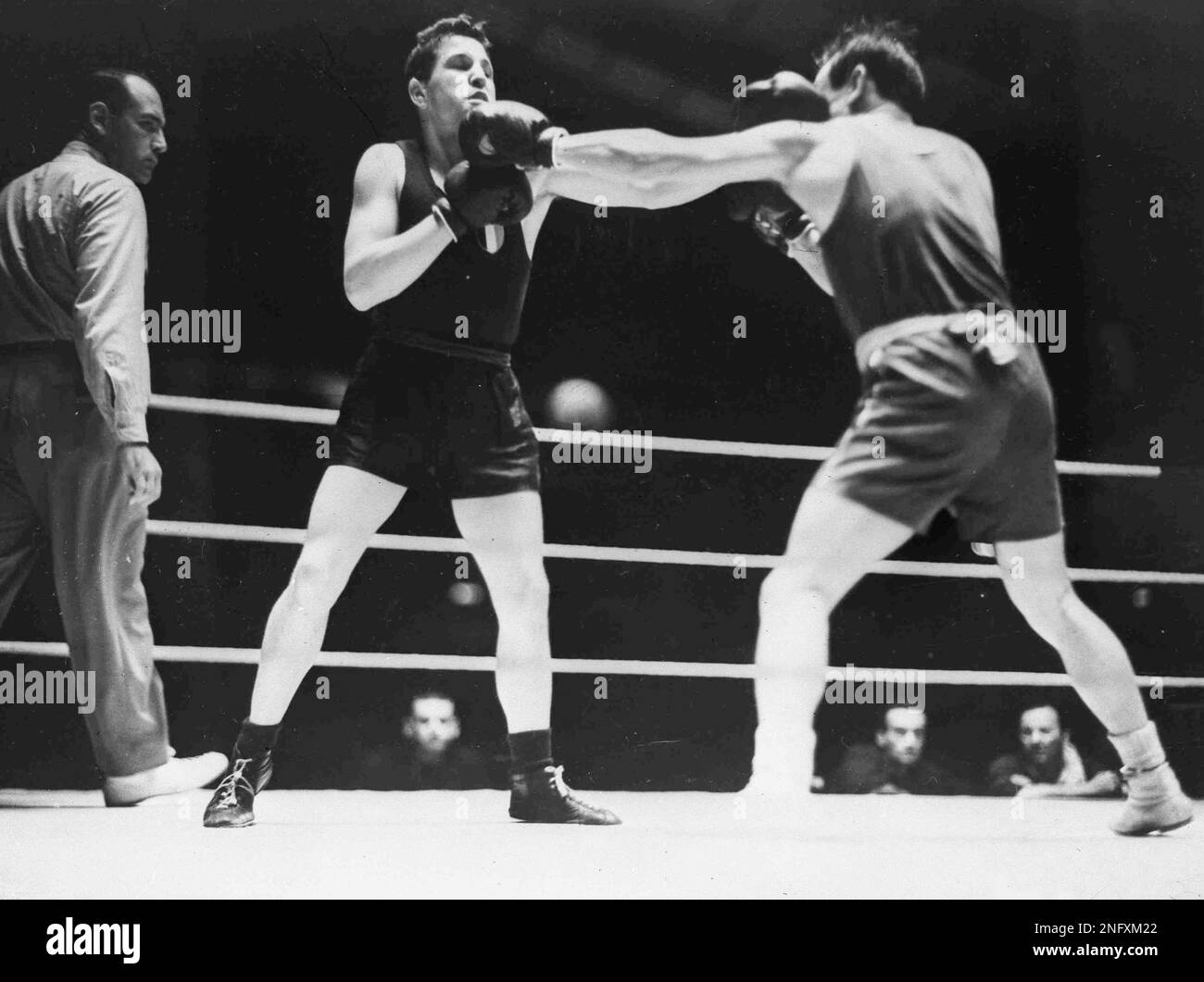Auguste Caulet of France, right, exchanges punches with Mario Minatelli ...