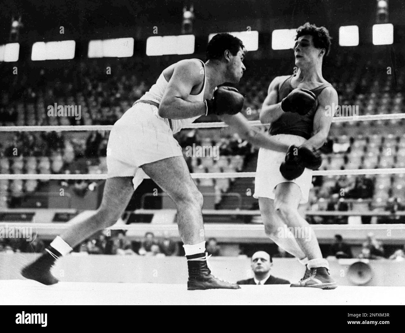 Uruguay's Felipe Posse, left, throws a punch at Czechoslovakia's Otakar ...