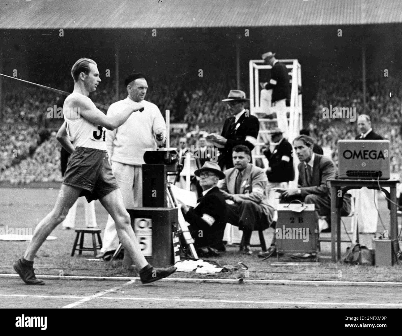 Sweden's John Mikaelsson, left, crosses the finish line to win the men ...