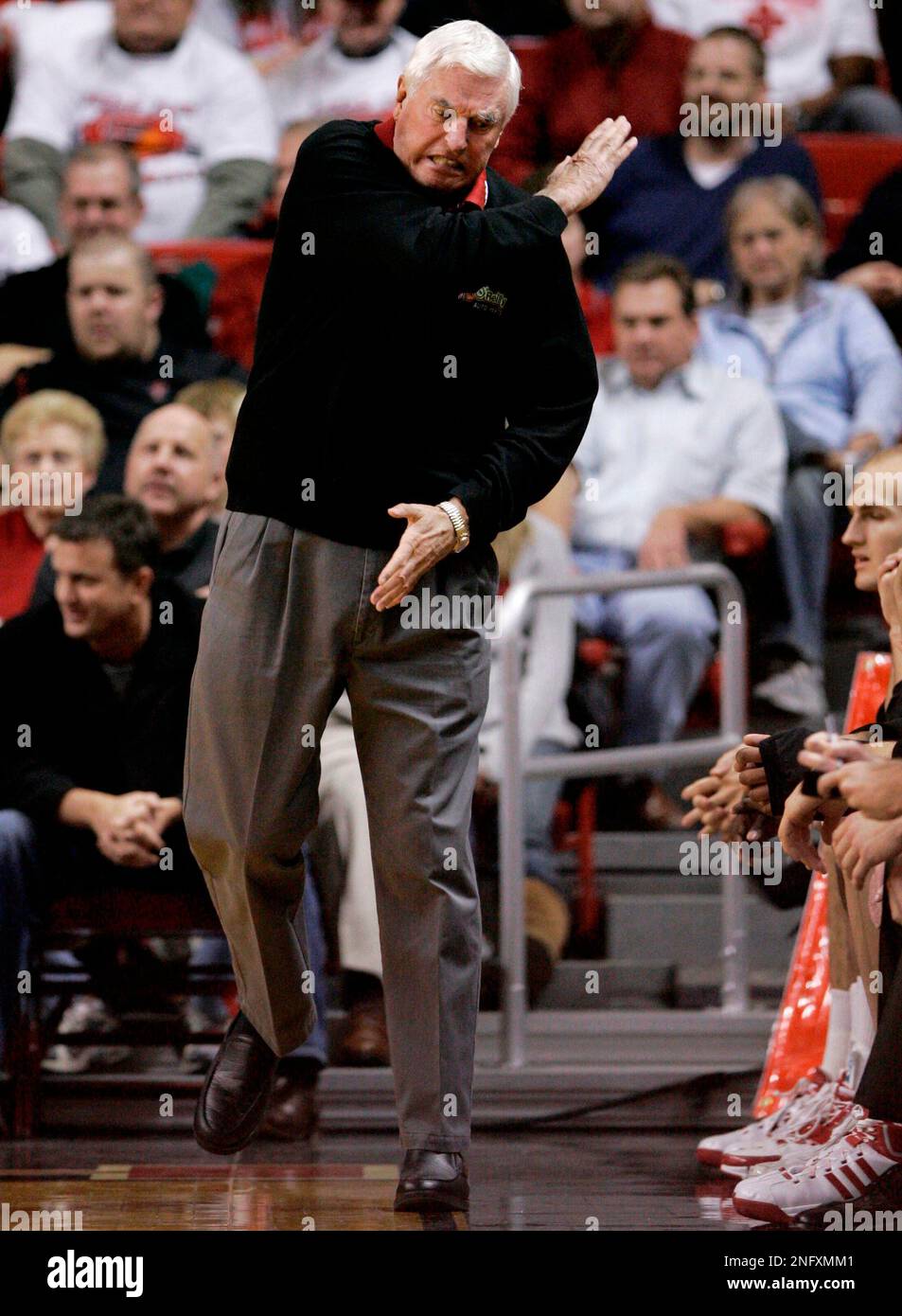 Texas Tech basketball coach Bob Knight slaps his hands together as he ...