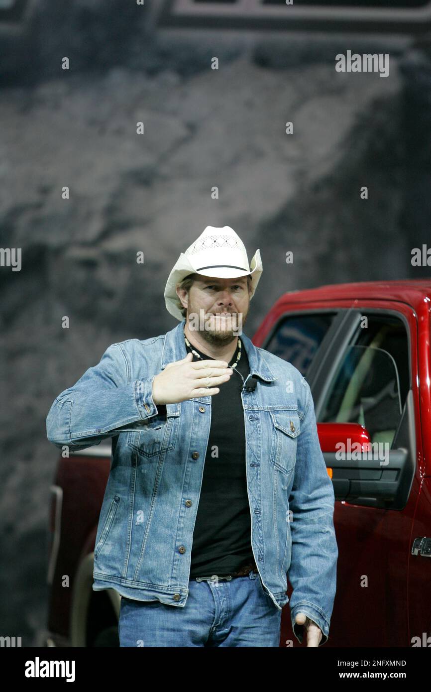 Country singer Toby Keith salutes as he introduces Foird F-150 at the ...