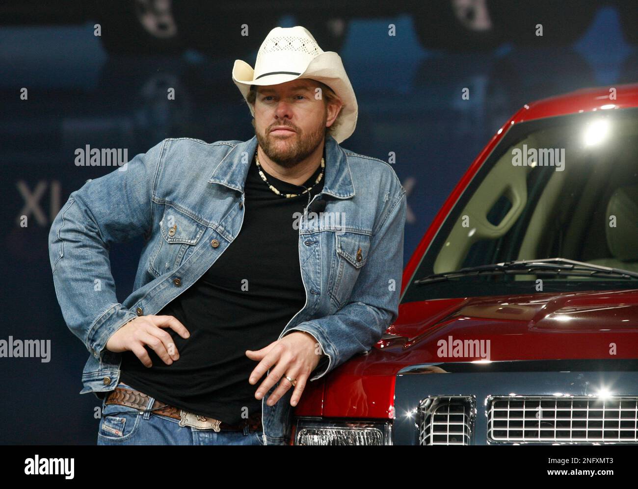 Country singer Toby Keith leans on Ford F-150 at the North American ...