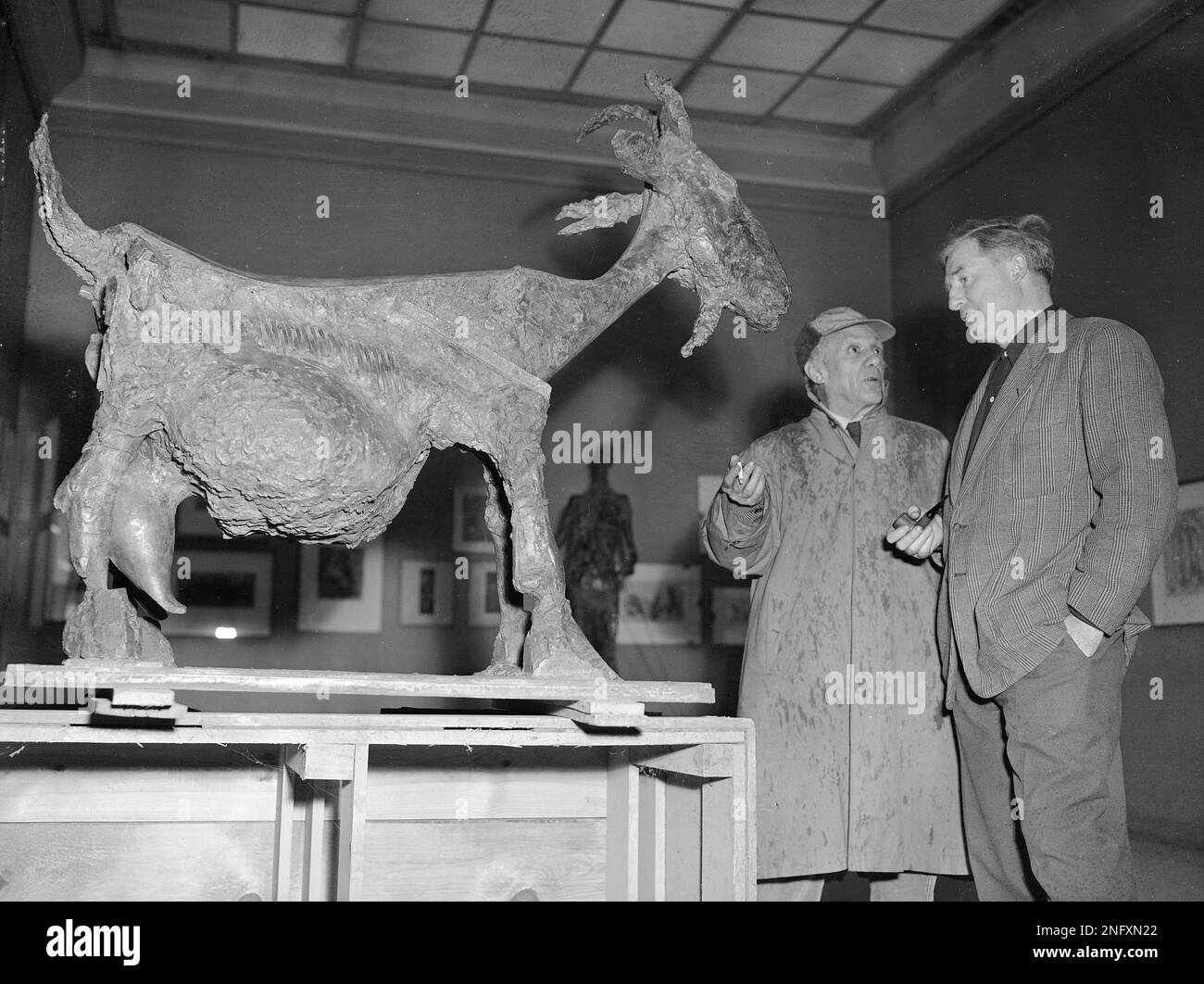 Artist Pablo Picasso is shown talking with painter Edouard Pignon at ...