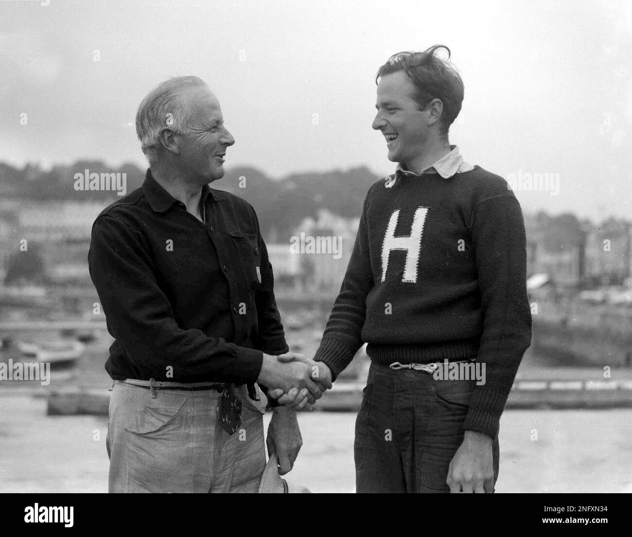 American Paul Smart, left, and his son Hilary Smart, congratulate each ...
