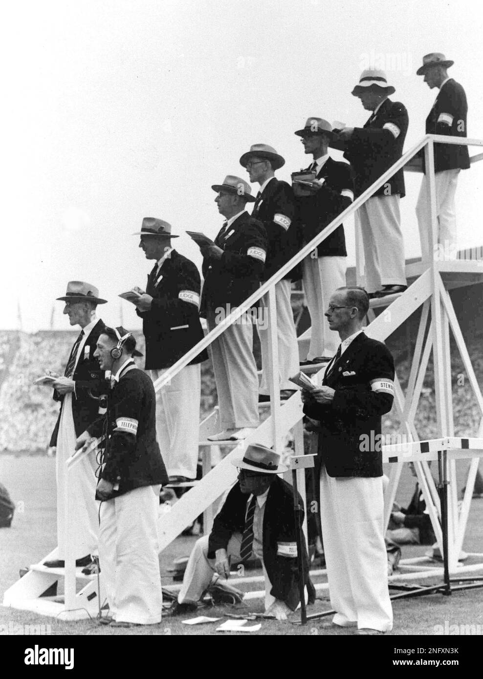 Judges concentrate on the women's Olympic Games discus competition at ...