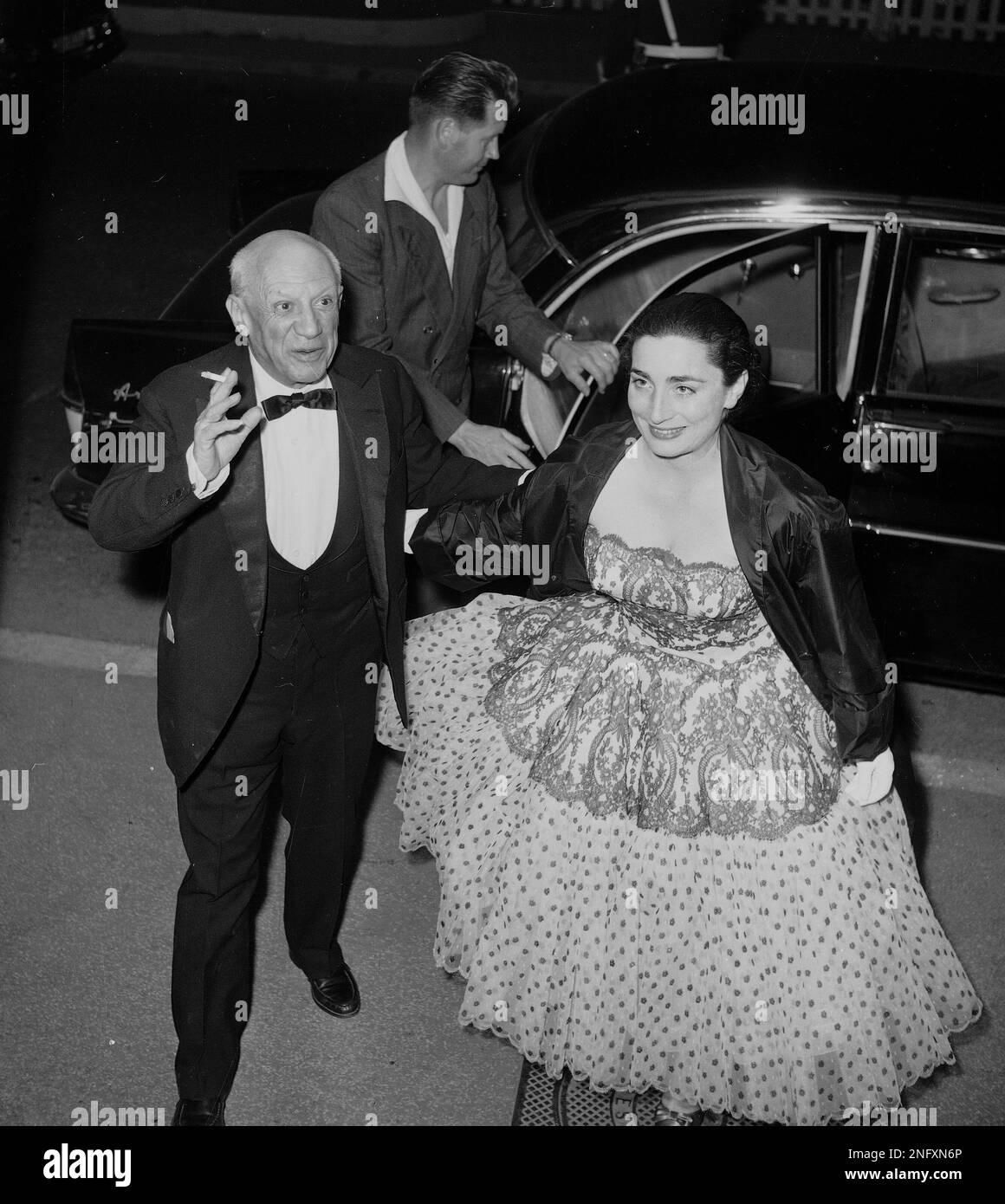 Artist Pablo Picasso and his model, Jacqueline Roque, arrive at the ...